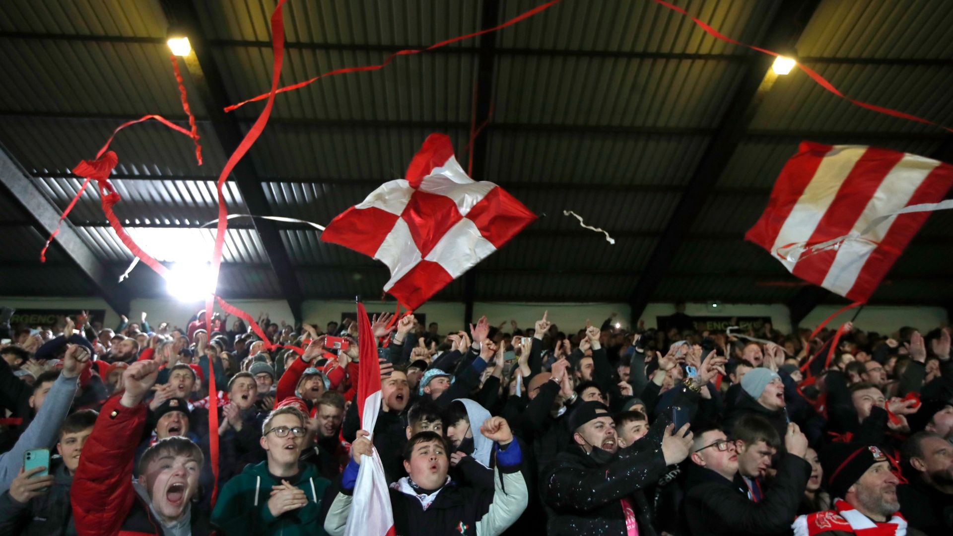 How wealthy is Swindon Town's owner?