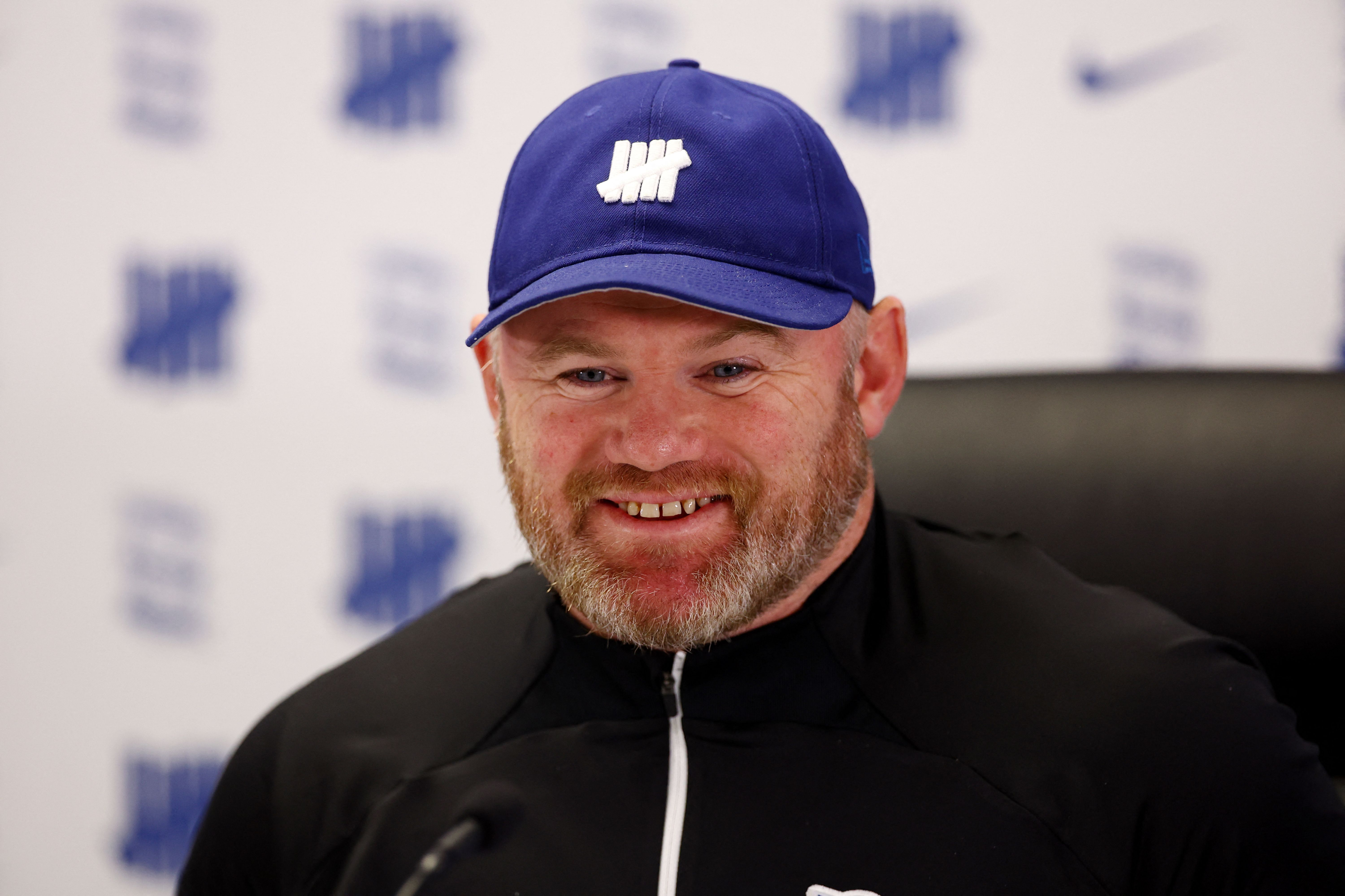 Birmingham City: Wayne Rooney reacts when asked if he knows the words ...